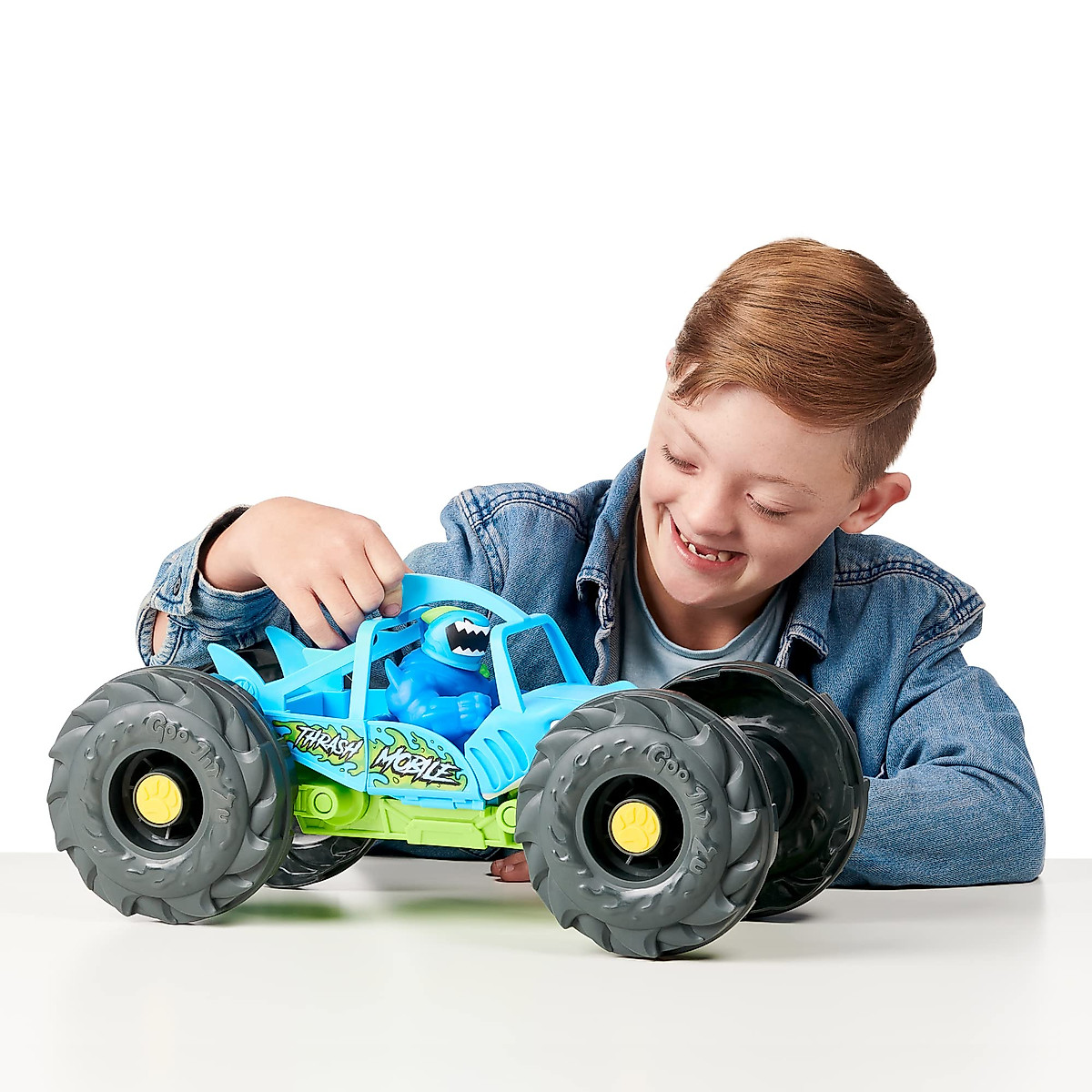 Heroes of Goo Jit Zu "Stretch and Strike Thrash Mobile! Vehicle with Missile Launcher and Stretchy, Goo Filled Exclusive Race Suit Thrash.