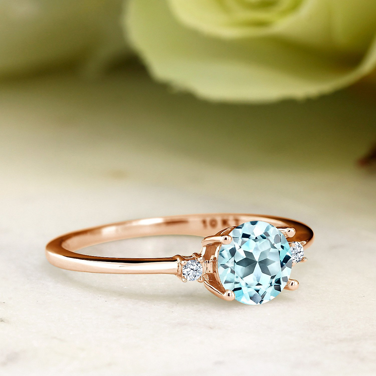 Gem Stone King 10K Rose Gold Sky Blue Topaz and White Created Sapphire Solitaire Engagement Ring For Women (0.93 Cttw, Round 6MM, Gemstone November Birthstone, Size 7)