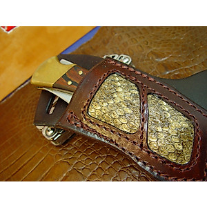 Buck 110 Rattlesnake Right-hand Cross Draw Knife Sheath. The Sheath Is Made Out of 10 Ounce Water Buffalo Leather and a Rattlesnake Insert. It is Made to Wear on Your Left-Side and Drawn with Your Right Hand the Sheath Is Dyed Dark Brown. Sheath Only the