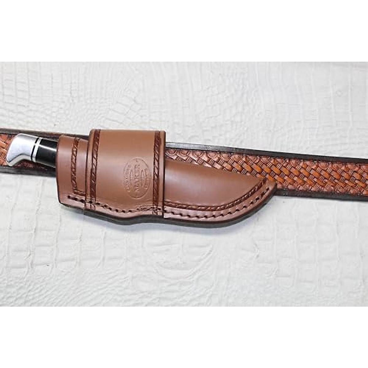 CARL THOMAS LEATHERS Crossdraw knife sheath. quality leather quality stitching. fix blade Nylon stitching. may defeat a 103. Knife holder.