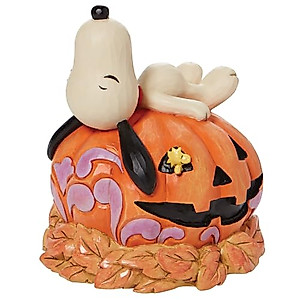 Enesco Peanuts by Jim Shore Halloween Snoopy Laying on Carved Pumpkin Figurine, 5.5 Inch, Multicolor