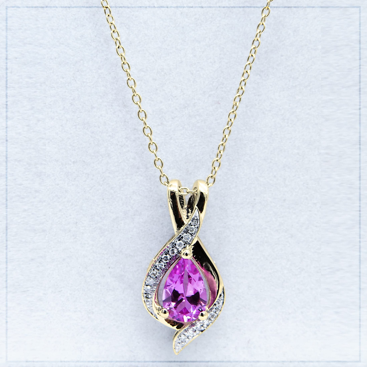Dazzlingrock Collection 9x6 mm Pear Lab Created Pink Sapphire & Round White Diamond Swirl Teardrop Pendant with 18 inch Gold Chain for Women in 10K Yellow Gold