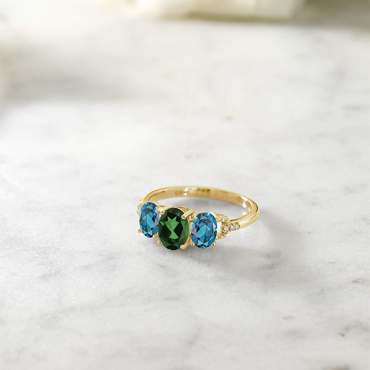 Gem Stone King 10K Yellow Gold Oval Emerald Envy Mystic Topaz London Blue Topaz and Diamond 3-Stone Engagement Ring For Women (2.02 Cttw, Gemstone Birthstone, Available In Size 5, 6, 7, 8, 9)