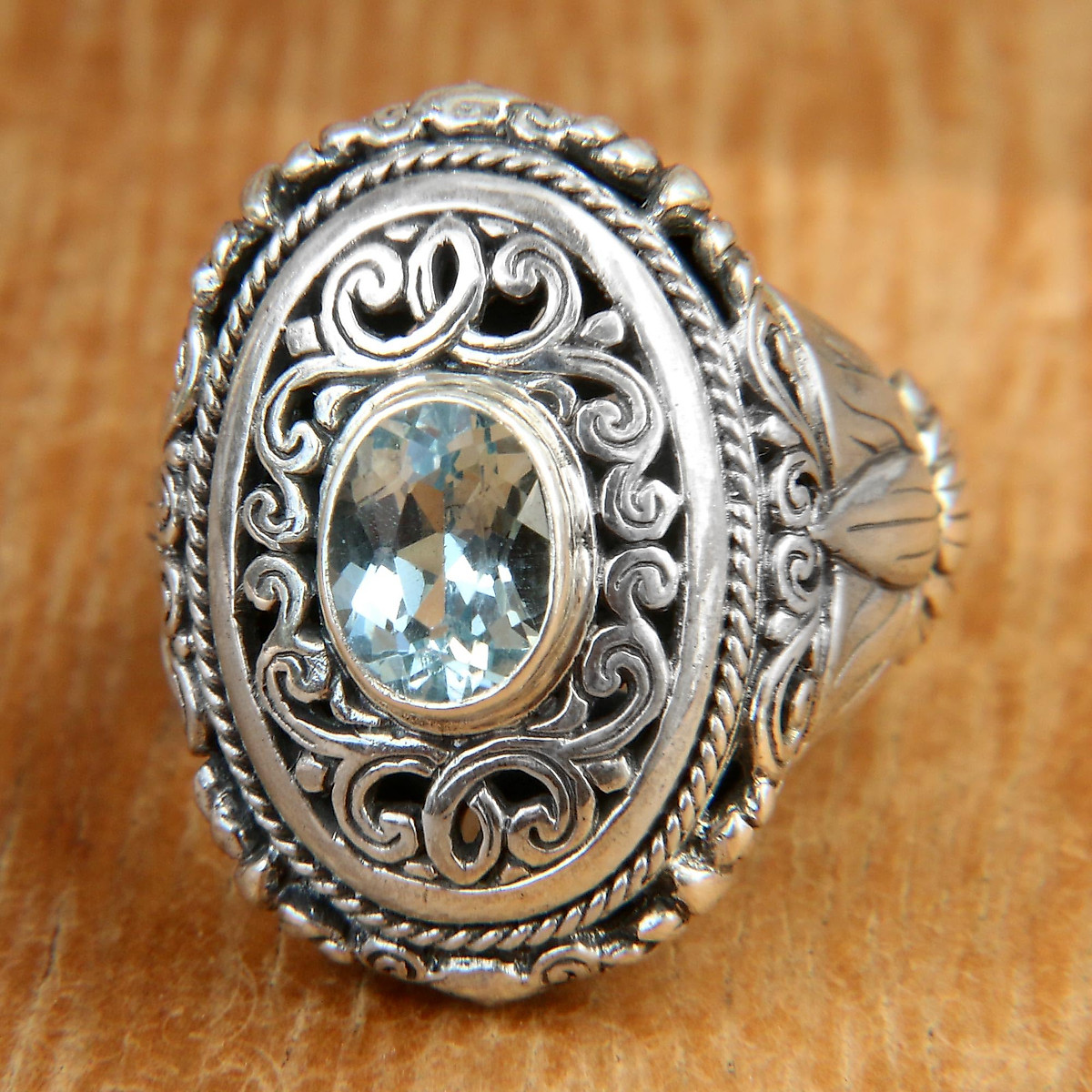 NOVICA Artisan Handmade Blue Topaz Cocktail Ring 1.5 Carat Sterling Silver Single Stone Indonesia Serenity Airy Birthstone [crownbezel 1 in L x 0.7 in W x 0.4 in D Band Width 4 mm W] ' Island Blue'