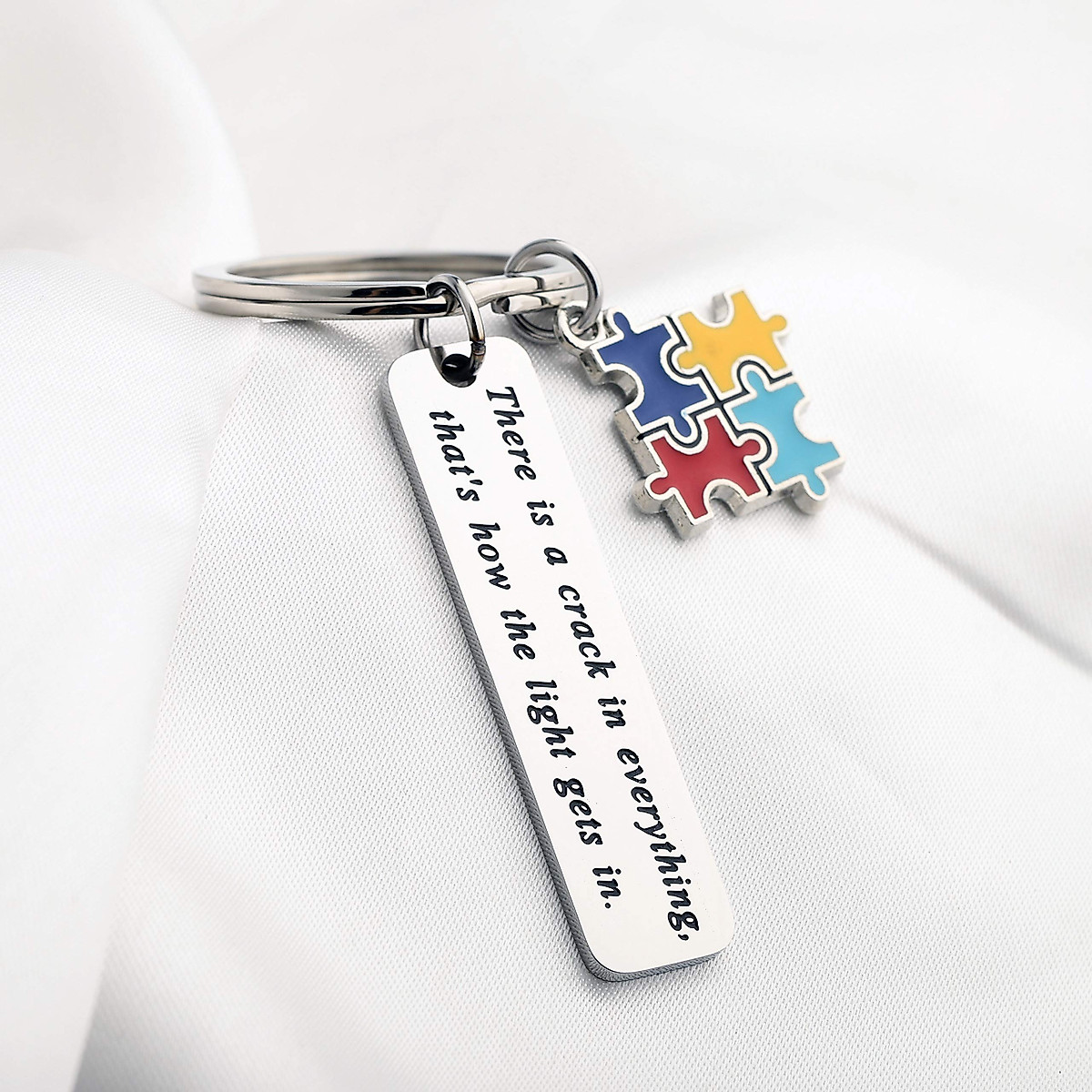FUSTMW Autism Awareness Keychain Gift Puzzle Piece Charm Autism Mom Inspirational Gift for Autistic Teen There is a crack in everything that is how the light gets in (silver)