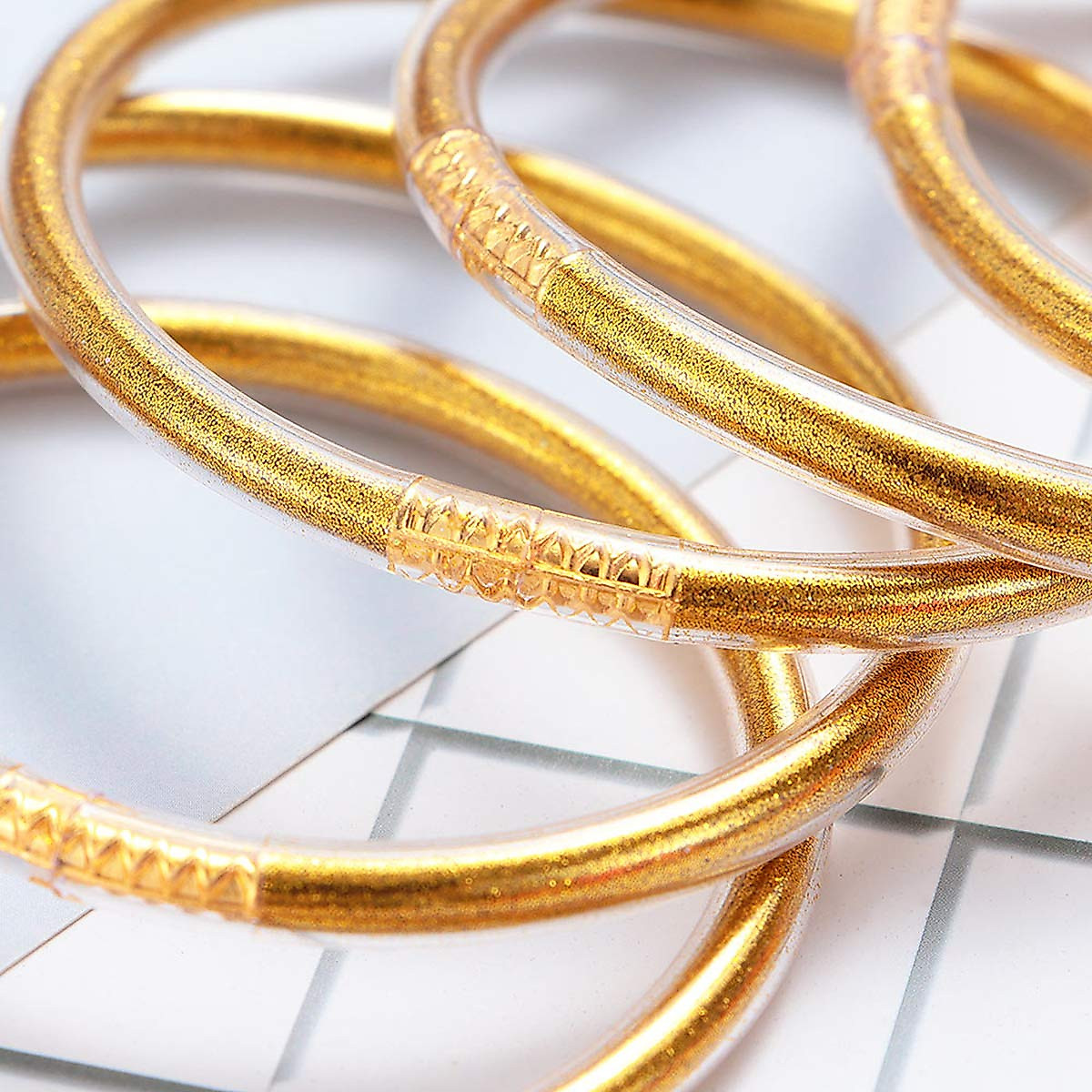 ATIMIGO Jelly Bangle Bracelets Set Lightweight Cute Gold Glitter Filled Stack Silicone Party Bracelets for Women