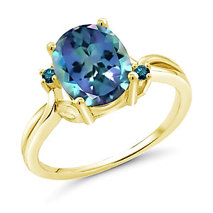 Gem Stone King 18K Yellow Gold Plated Silver Millennium Blue Mystic Topaz and Blue Diamond 3 Stone Ring For Women (3.03 Cttw, Oval 10X8MM, Gemstone Birthstone, Available In Size 5, 6, 7, 8, 9)