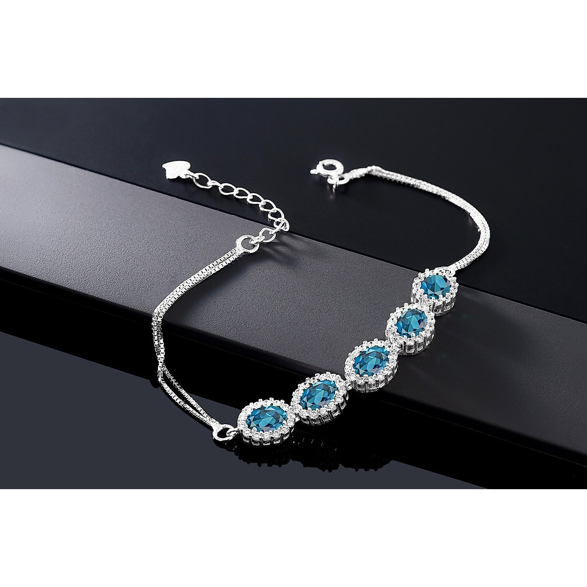 Gem Stone King 925 Sterling Silver London Blue Topaz Tennis Bracelet For Women (5.54 Cttw, Gemstone Birthstone, Oval 7X5MM, 7 Inch + 1.5 Inch Extender)