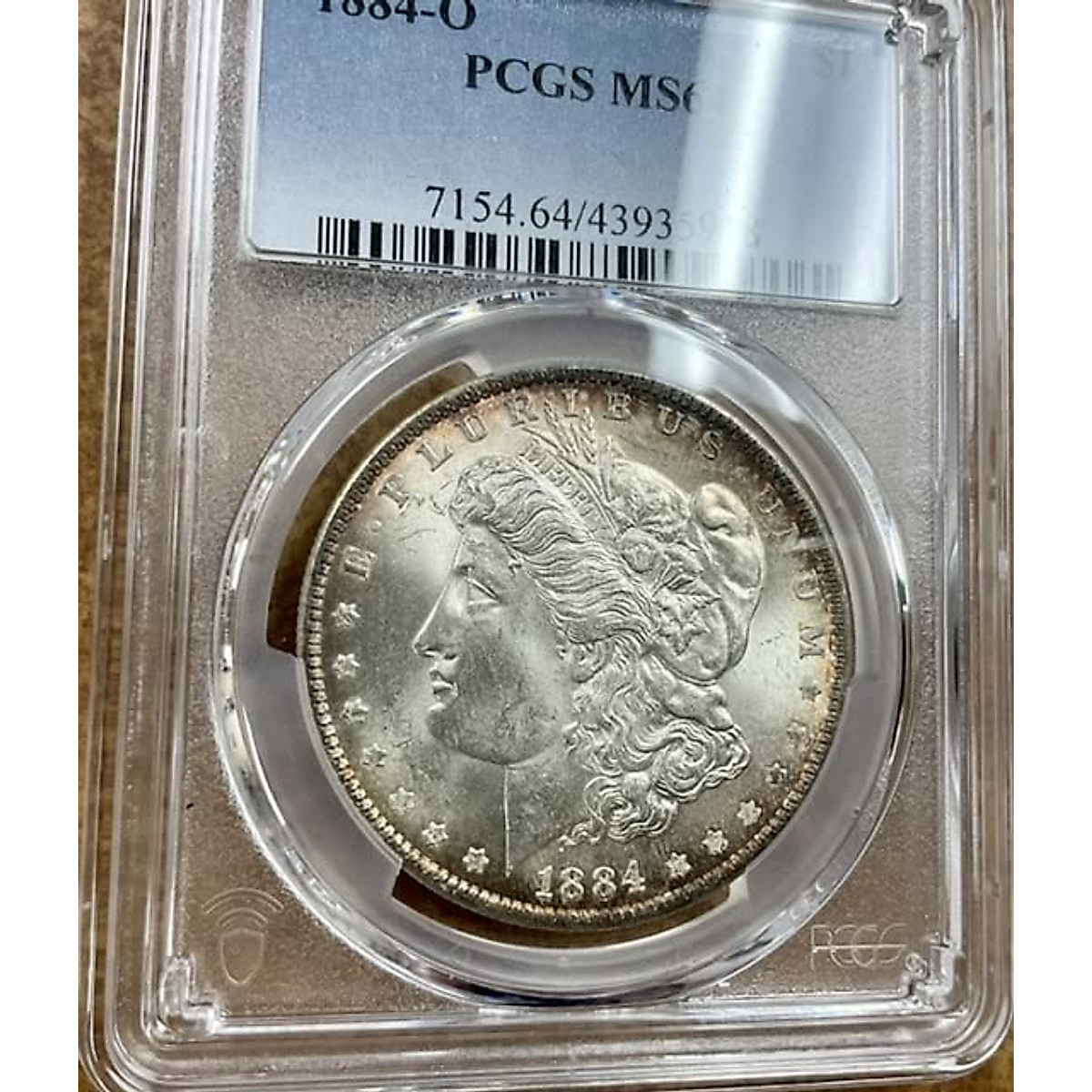 1884 O Morgan silver dollar, bright, reddish bronze rim toning $1 PCGS MS-64