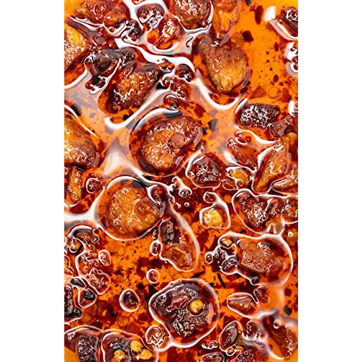 Hot Crispy Oil, An all natural unique blend of fresh fried shallots, fresh garlic and a proprietary blend of three different chili peppers. Highly addictive.