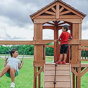 Backyard Discovery Sterling Point All Cedar Wooden Swing Set, Raised Clubhouse,Web Swing, Climbing Wall, 10ft Wave Slide, 2 Belt Swings, Front Porch, Bridge