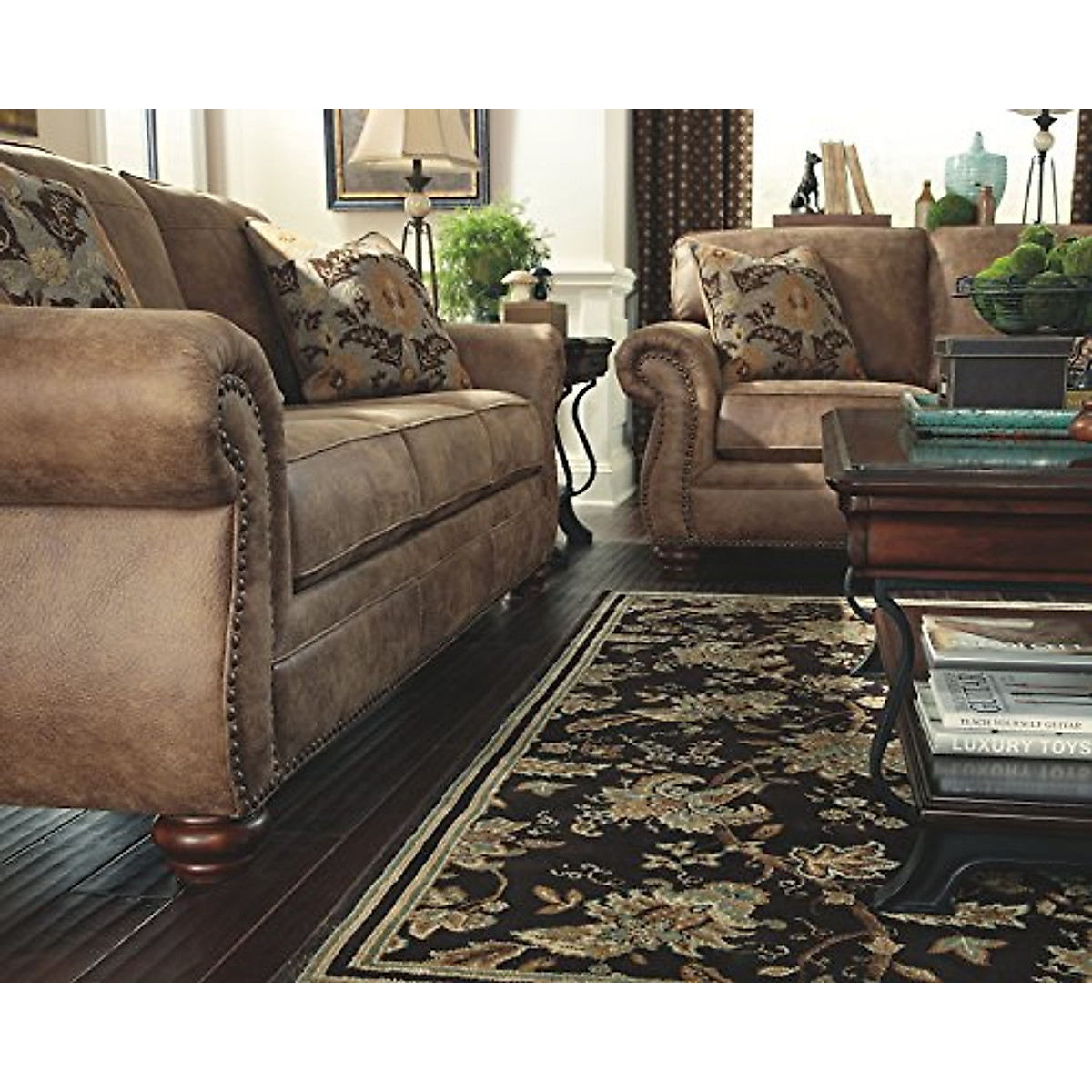 Signature Design by Ashley Larkinhurst Faux Leather Sofa with Nailhead Trim and 2 Accent Pillows, Brown