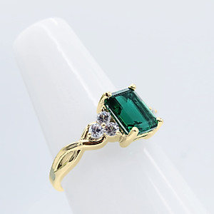 Dazzlingrock Collection 8x6mm Emerald Cut Center Emerald & 2.2mm Round Lab Created White Sapphire Crisscross Shank Engagement Ring for Women in 10K Yellow Gold Size 5