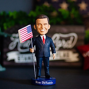 Governor Ron Desantis Bobblehead Collectible | 7” Tall Resin Figurine of Desantis Holding an American Flag | Governor Desantis Bobble