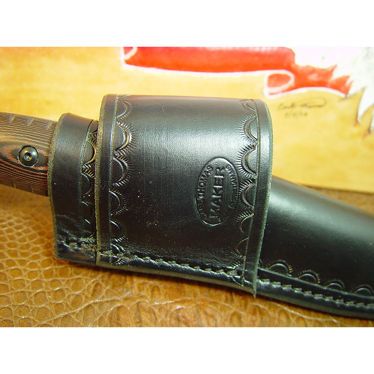 Custom cross draw knife sheath for the buck Selkirk knife. The sheath is made out of water buffalo hide leather Black.