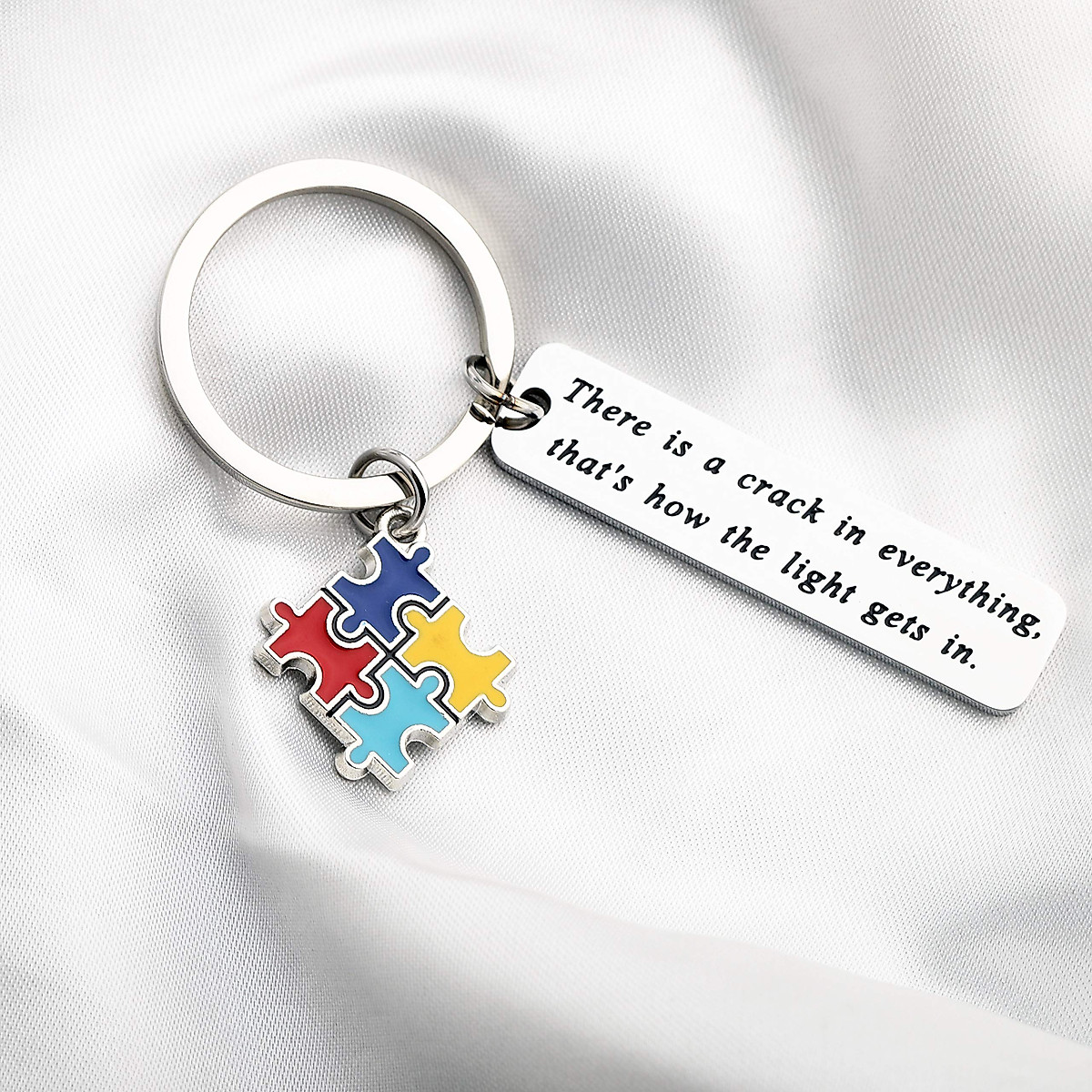 FUSTMW Autism Awareness Keychain Gift Puzzle Piece Charm Autism Mom Inspirational Gift for Autistic Teen There is a crack in everything that is how the light gets in (silver)