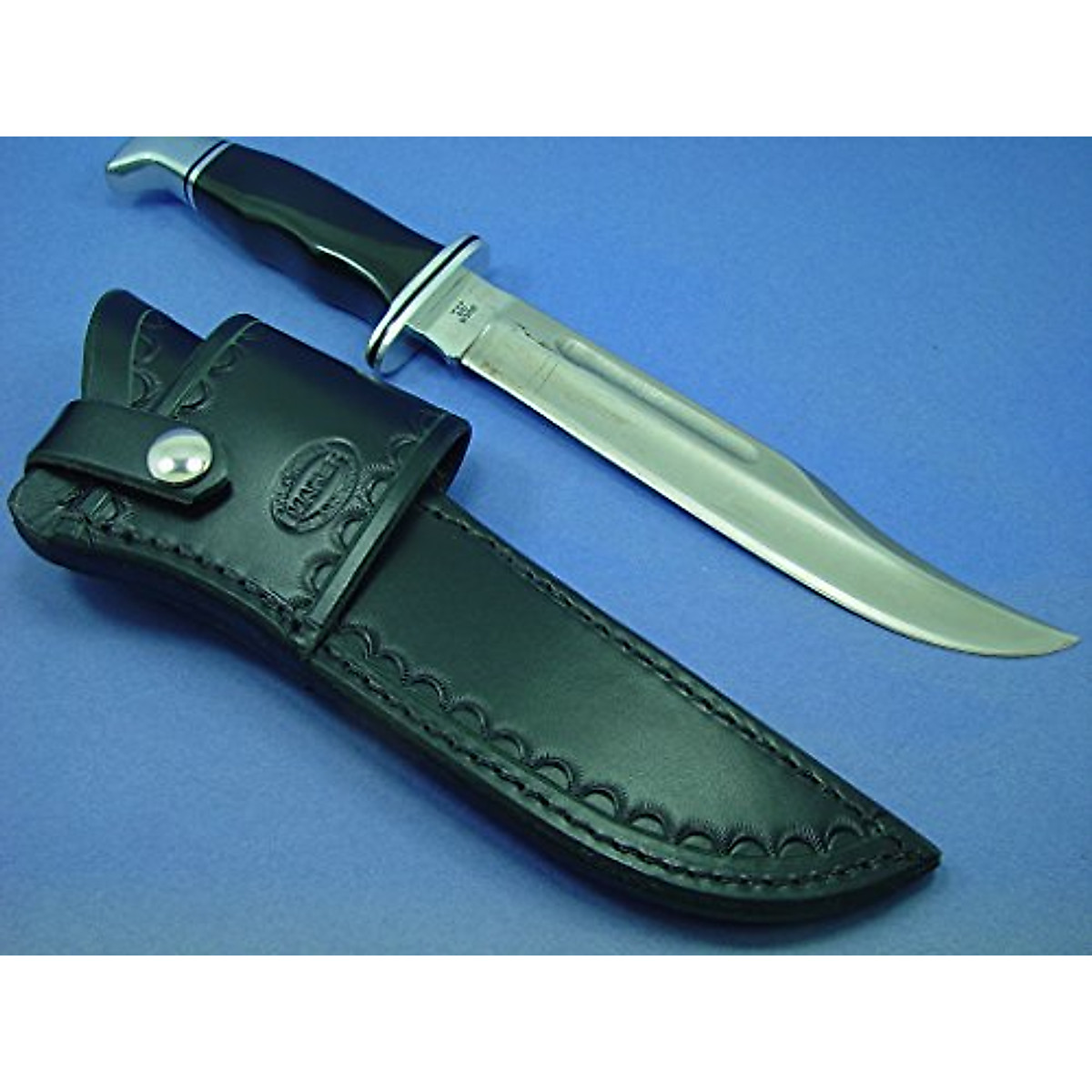 Custom Cross Draw Knife Sheath for the Buck 120 Knife. The Sheath Is Made Out of 10 Ounce Water Buffalo Hide Leather. The Water Buffalo Leather Is Very Soft Durable and Pliable. The Sheath Can Be Worn on the Right or Left Hand Side. It Has a Snap to Secur