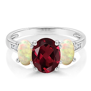 10K White Gold Red Rhodolite Garnet White Ethiopian Opal and White Diamond Oval 3-Stone Engagement Ring For Women (1.99 Cttw, Gemstone January Birthstone, Available In Size 5, 6, 7, 8, 9)