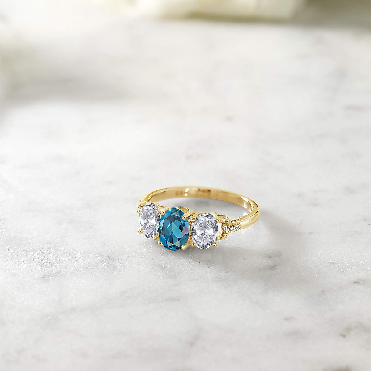 Gem Stone King 10K Yellow Gold London Blue Topaz White Topaz and Diamond Accent Engagement Ring For Women (2.22 Cttw, Oval Gemstone Birthstone, Available in size 5, 6, 7, 8, 9)