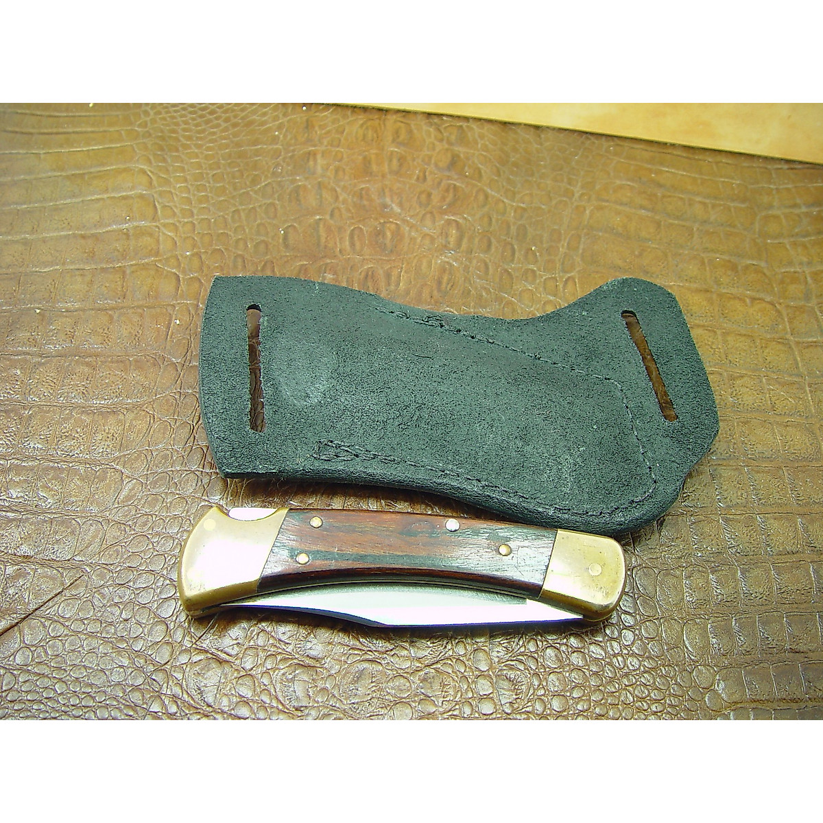 Custom Left Hand Cross Draw Knife Sheath for a Buck 110 Knife. The Sheath is Made Out of Buffalo Hide Leather Dyed Black.