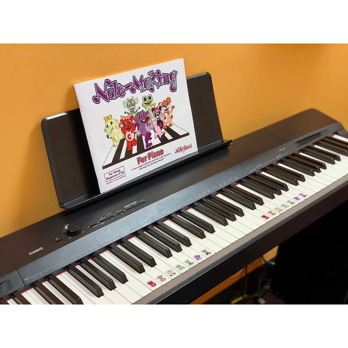 Note-Making for Piano: A color-coded piano book for kids with Note-Friend piano stickers.
