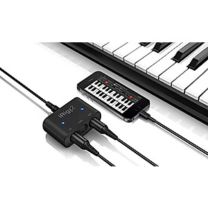 IK Multimedia iRig MIDI 2 universal MIDI interface with In, Out, and THRU ports, activity indicators for iPhone, iPad, Android, Mac, PC