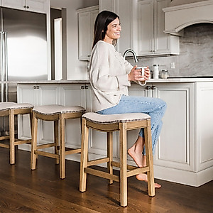 Maven Lane Adrien 26 Inch Counter Height Upholstered Backless Saddle Barstool in Natural Wood Finish with Wheat Cream Fabric Cushion Seat