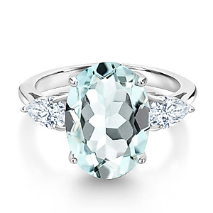 Gem Stone King 925 Sterling Silver Oval Sky Blue Simulated Aquamarine and White Moissanite 3 Stone Ring For Women (6.50 Cttw, Available In Size 5, 6, 7, 8, 9)