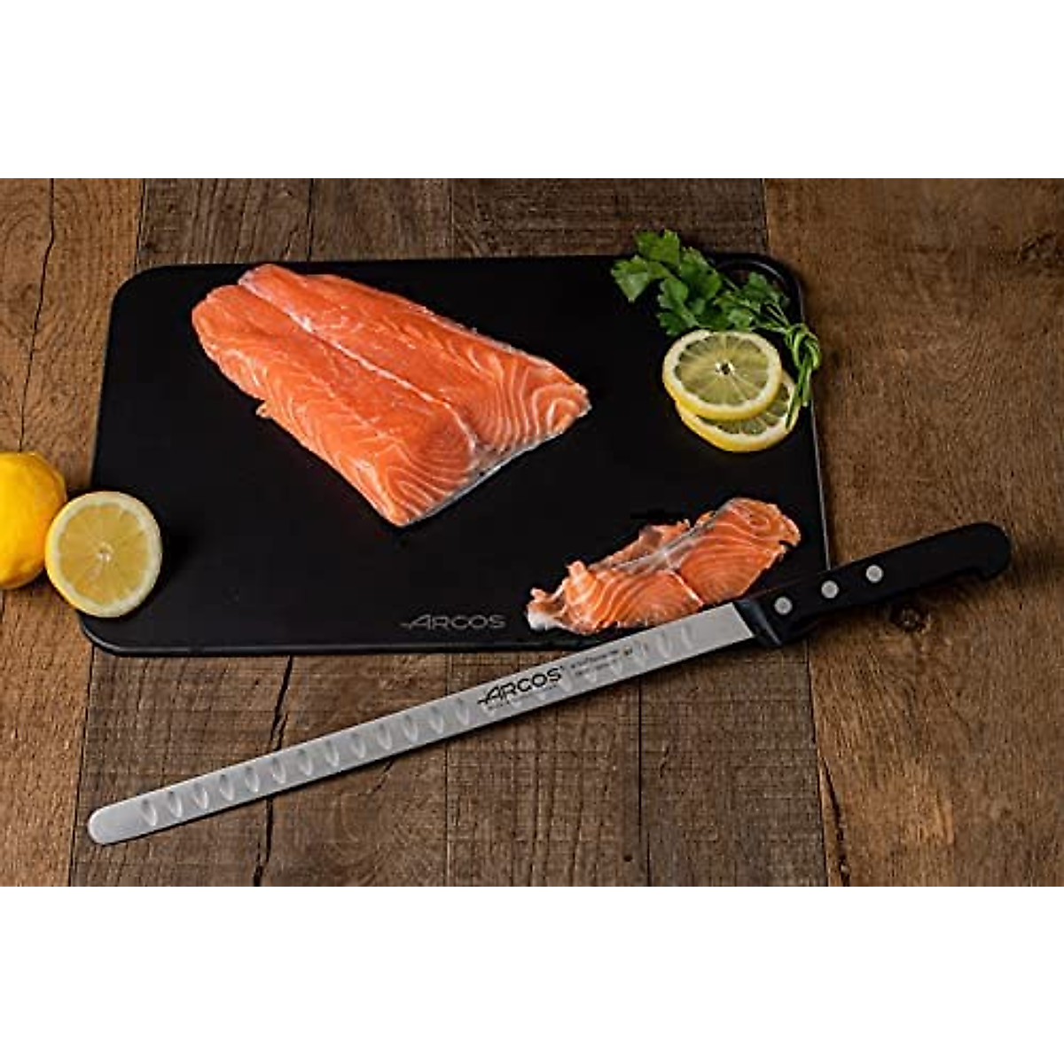 ARCOS Salmon Knife / Fish Knife 11 Inch Nitrum Stainless Steel and 290 mm blade. Ergonomic Polyoxymethylene POM Handle. Series Universal. Long, sturdy blade and serrated edge. Easily cuts. Color Black