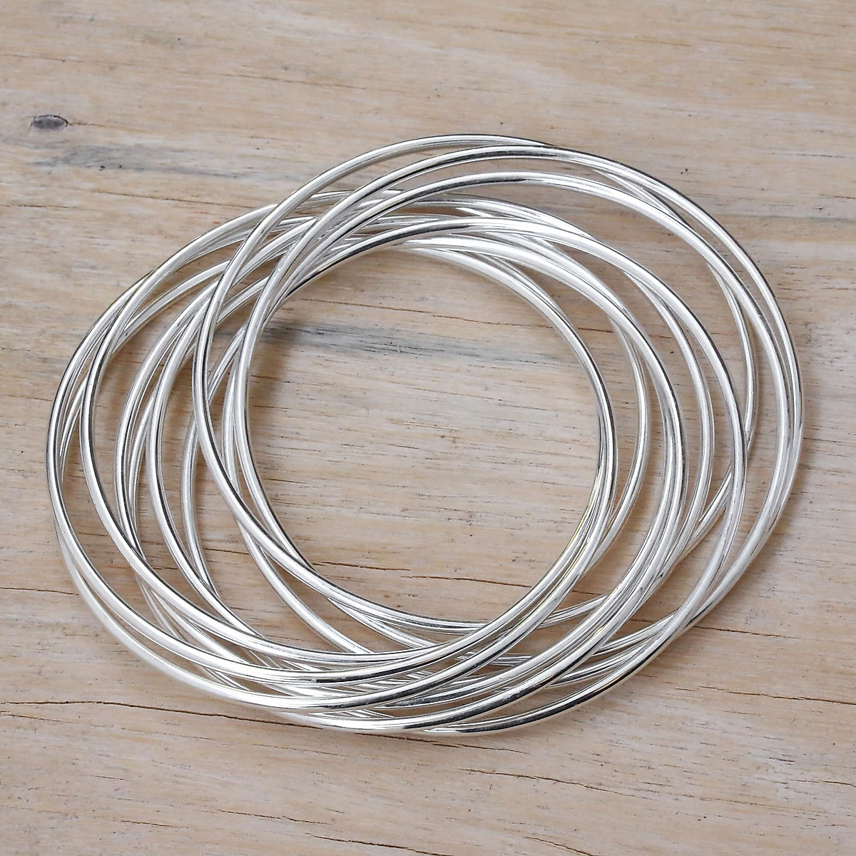 NOVICA Artisan Handmade Sterling Silver Bangle Bracelet with 10 Bands from Bali No Stone Indonesia Modern [8 in Inner Circ. x 0.4 in W] ' Fortified Union'