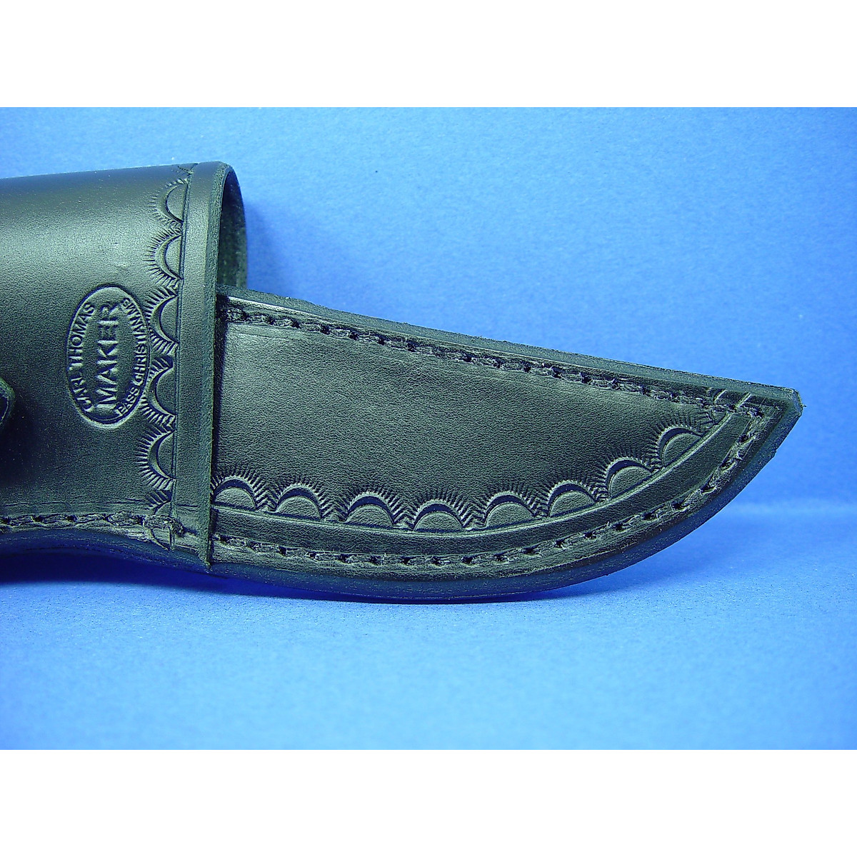 Buck 119 Cross Draw Knife Sheath. This Sheath Is Made Out of 8 Ounce Leather the Leather Is Very Soft Durable and Pliable You Will Not Need to Line Your Sheath for Your Finer Knives. The Leather Is Dyed Black with Border Tooling. The Sheath Can Be Worn on