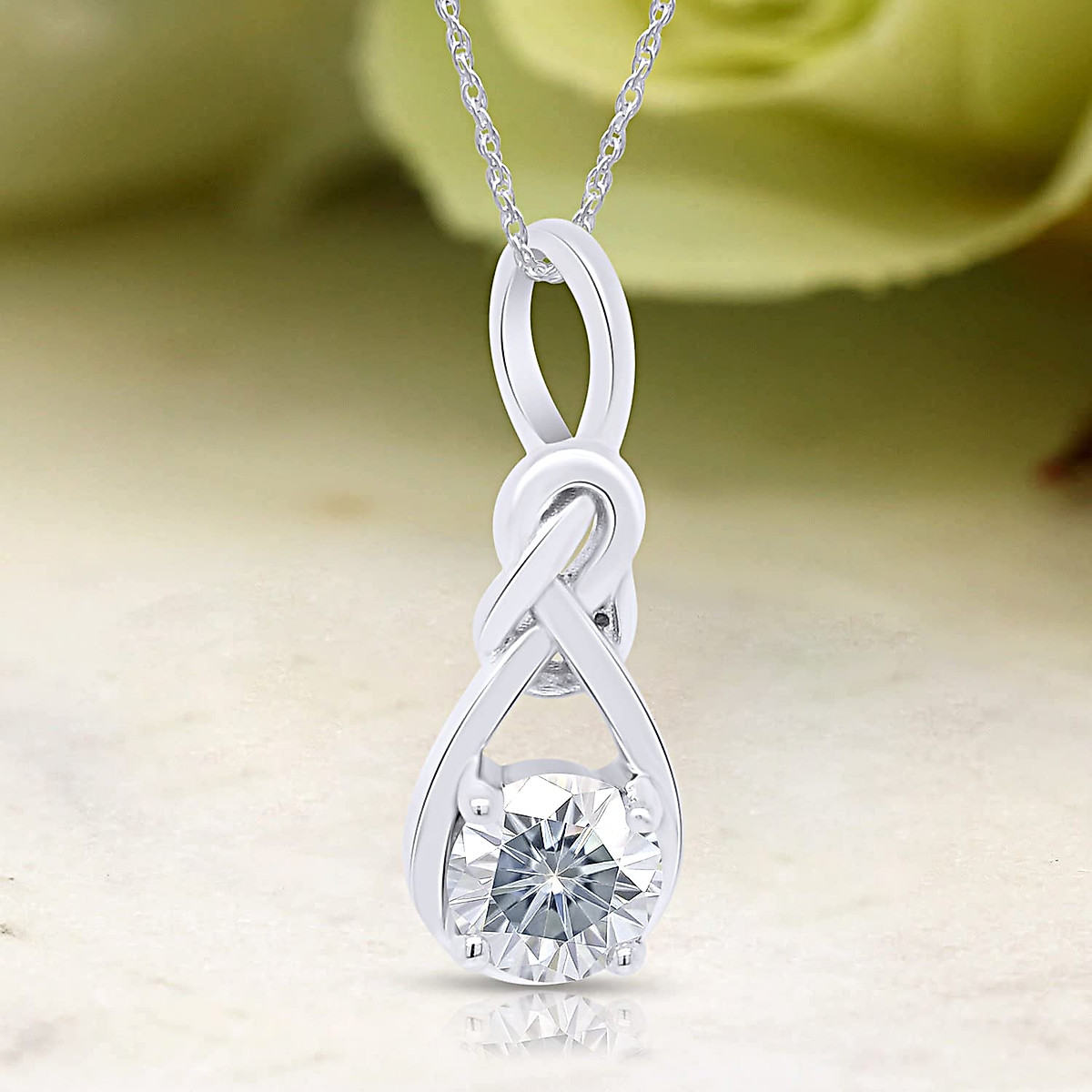SAVEARTH DIAMONDS 1/2 Carat Round Cut Lab Created Moissanite Diamond Love Knot Solitaire Pendant Necklace In 14k White Gold Over Sterling Silver With 18" Chain (VVS1 Clarity, 0.50 Cttw)