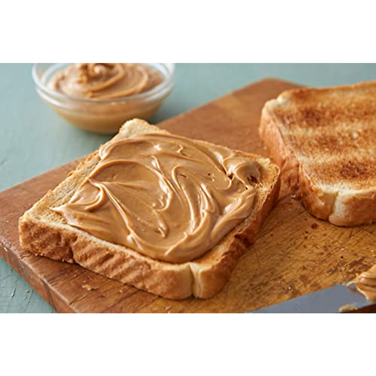 Peter Pan Creamy Peanut Butter, Made with Roasted Peanuts, Great for Peanut Butter and Jelly Sandwiches and Peanut Butter Snacks, Gluten Free Peanut Butter, 16.3 OZ Jar (Pack of 12)