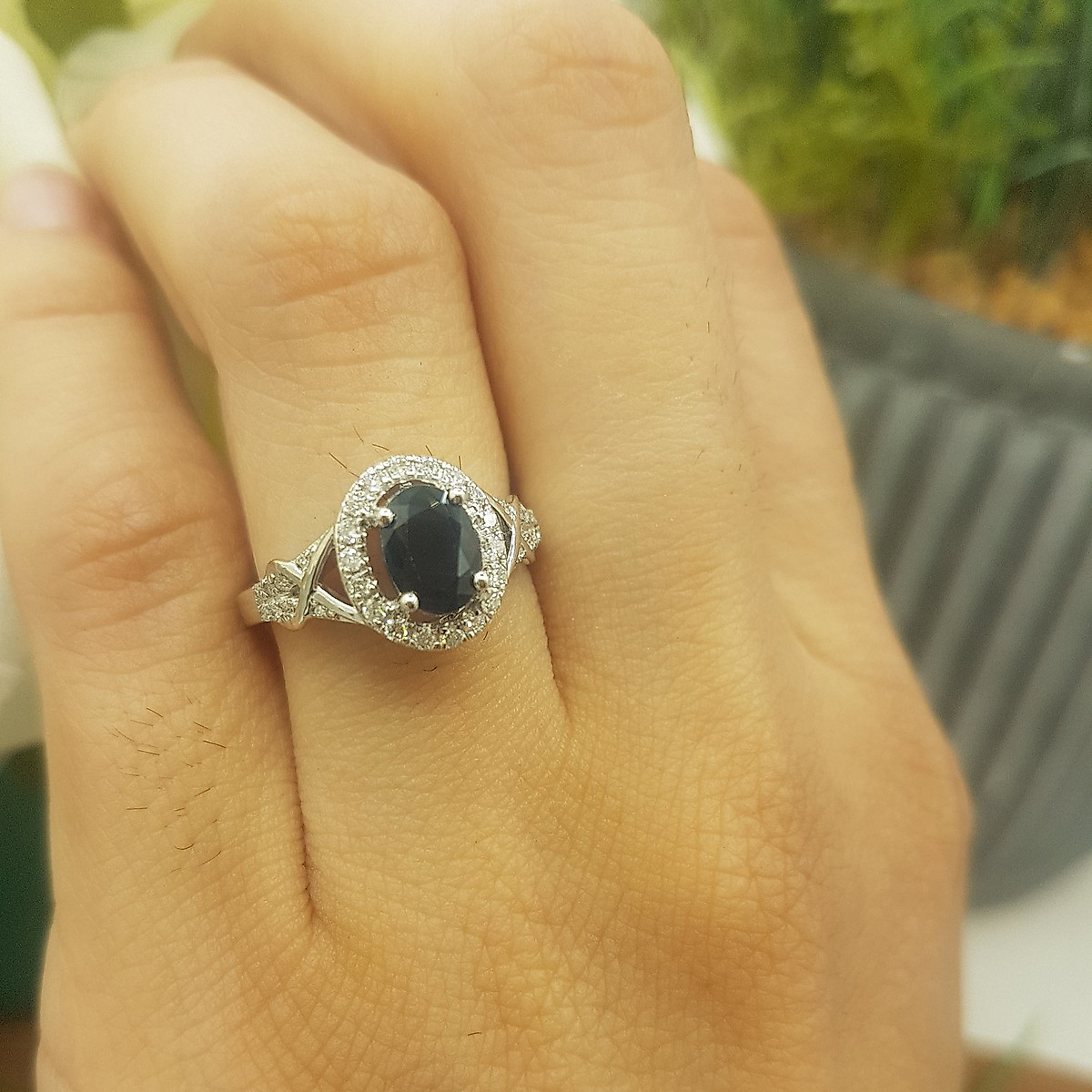 Dazzlingrock Collection 7x5mm Oval Blue Sapphire & Round White Diamond Split Shank Halo Engagement Ring for Women (0.25 ctw, Color I-J, Clarity I2-I3) in 10K White Gold, Size 7.5