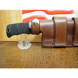 Custom Made Cross Draw Knife Sheath That Will fit The SOG Seal pup Light Brown. A lot of Leather for The Price and can be Worn on The Left or Right Hand Side. Sheath only.