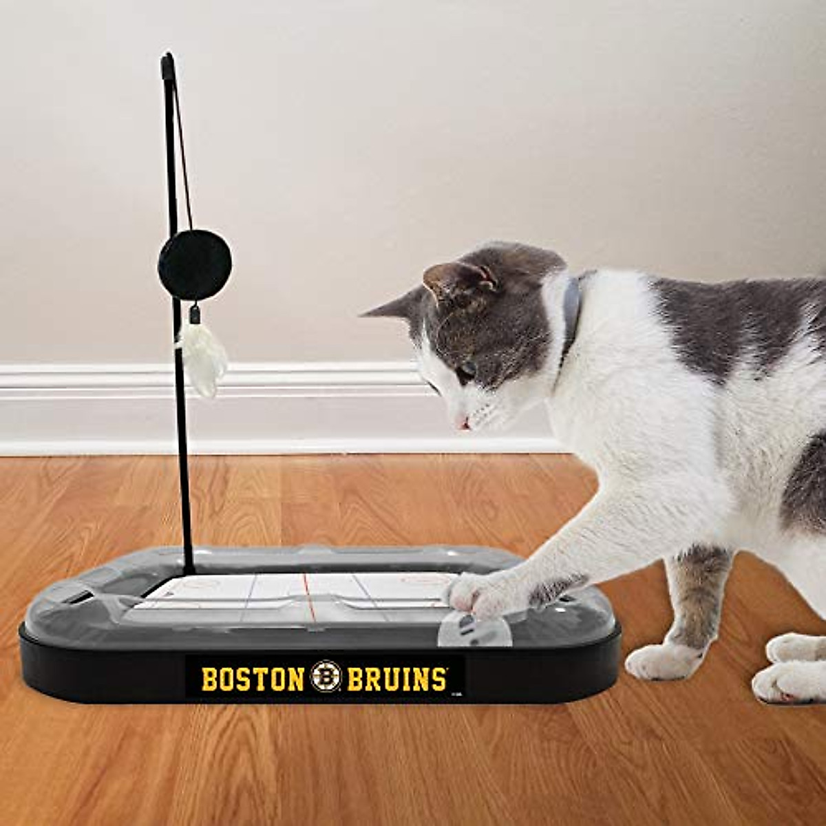 Pets First Cat Scratching Toy NHL Boston Bruins Hockey Field Cat Scratcher Toy with Interactive Cat Ball Bell in Tracks. 5-in-1 CAT Toy: Cat Wand Poll with Catnip Filled Plush Hockey Puck & Feathers.
