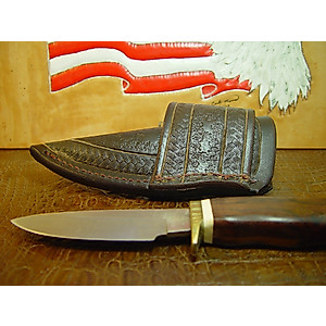 New Buck Vanguard Cross Draw Knife Sheath. Made of 10 Oz Water Buffalo Leather and Has a Rope Pattern Tooling with Random Patterning in the Center of the Sheath. Sheath ONLY!