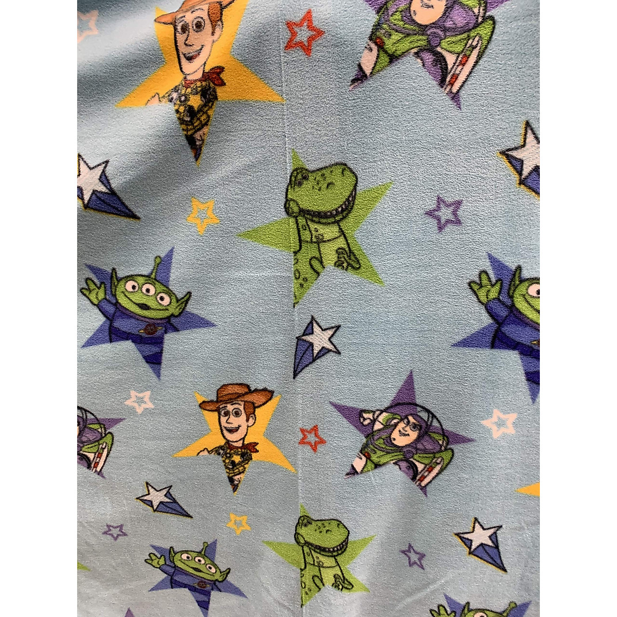 Disney Toy Story 4 Character Stars on Sky Blue Fleece from Springs Creative Buzz Light Year and Woody Fabric by The Yard