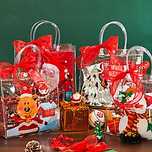 Henoyso 24 Pcs Christmas Clear Gift Bags Plastic Candy Treat Bags Snowman Santa Gift Bags with Handles and Ribbon PVC Gift Wrap Totes for Xmas Party Favors(7.8 x 7.8 x 3.1)