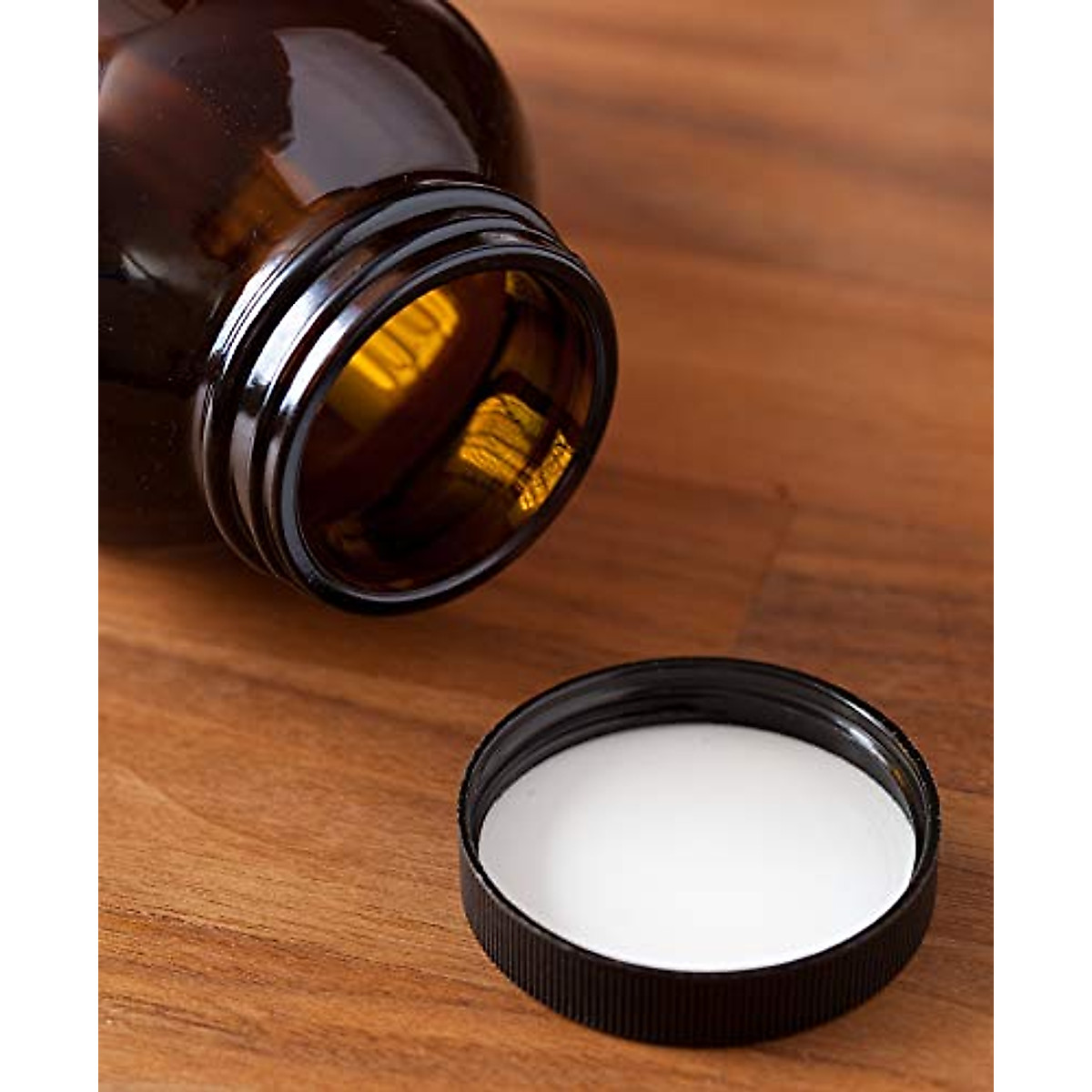 Amber 17 oz Wide Mouth Glass Packer Bottle with Black Ribbed Lid (4 pack)